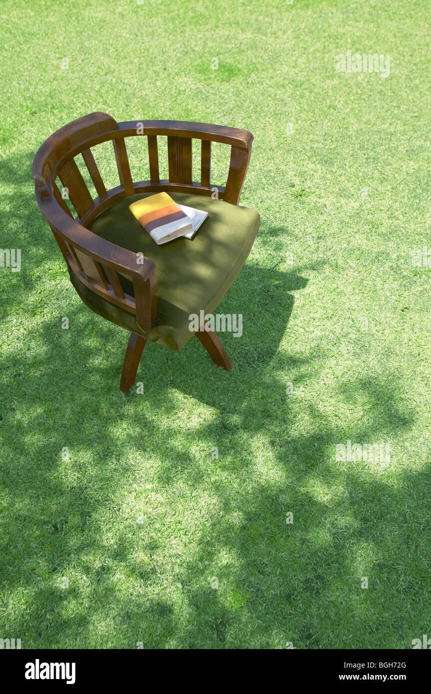 Wooden chair on a lawn Stock Photo - Alamy
