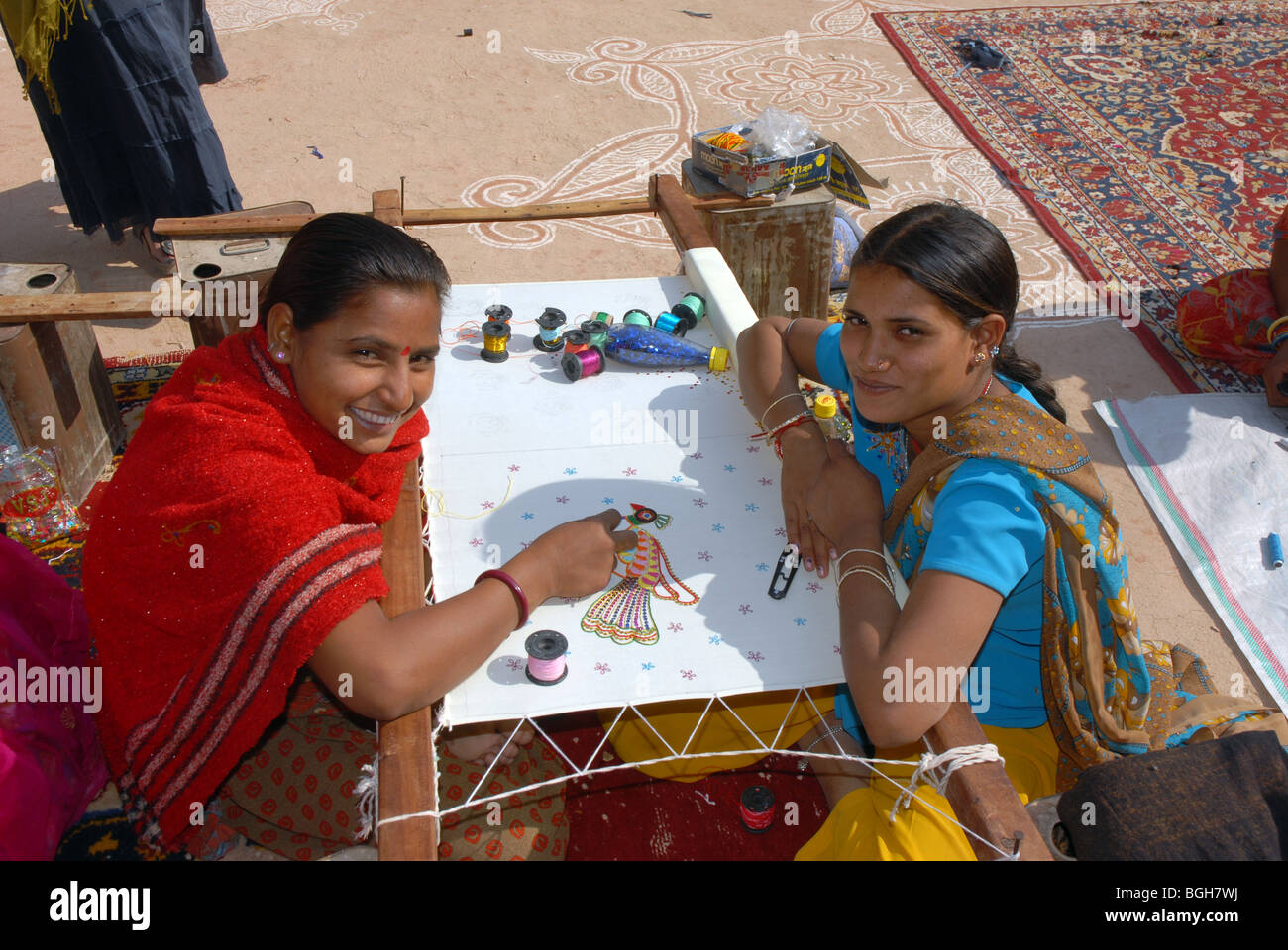 Rajasthani women and girls in a co-operative working with traditional ...