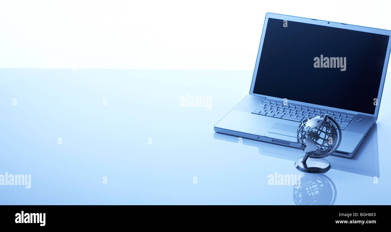 Globe with laptop hi-res stock photography and images - Alamy