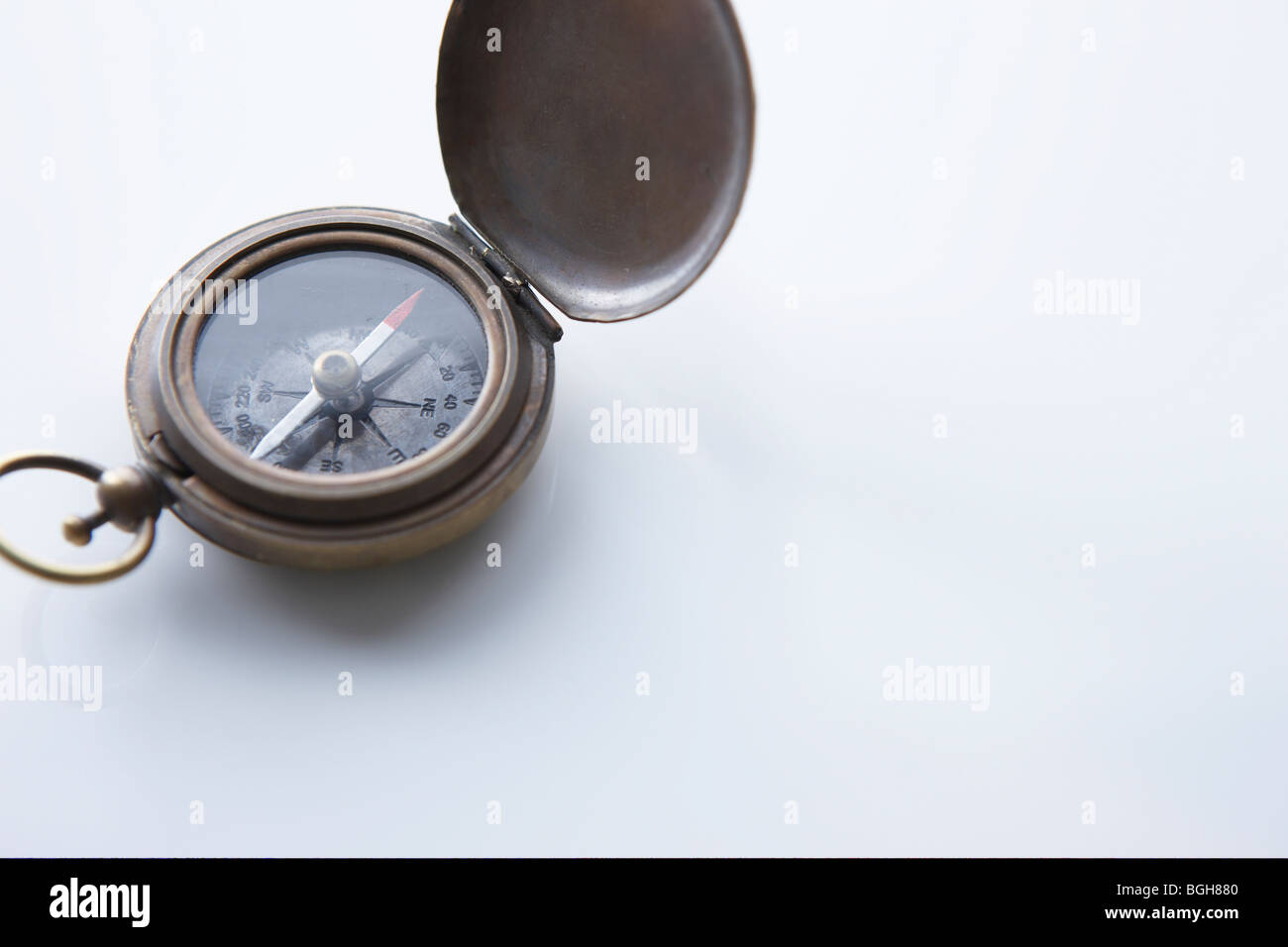 Compass on white background Stock Photo - Alamy