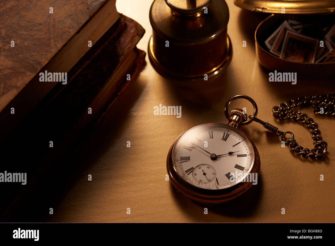 Antique pocket watch and books Stock Photo - Alamy