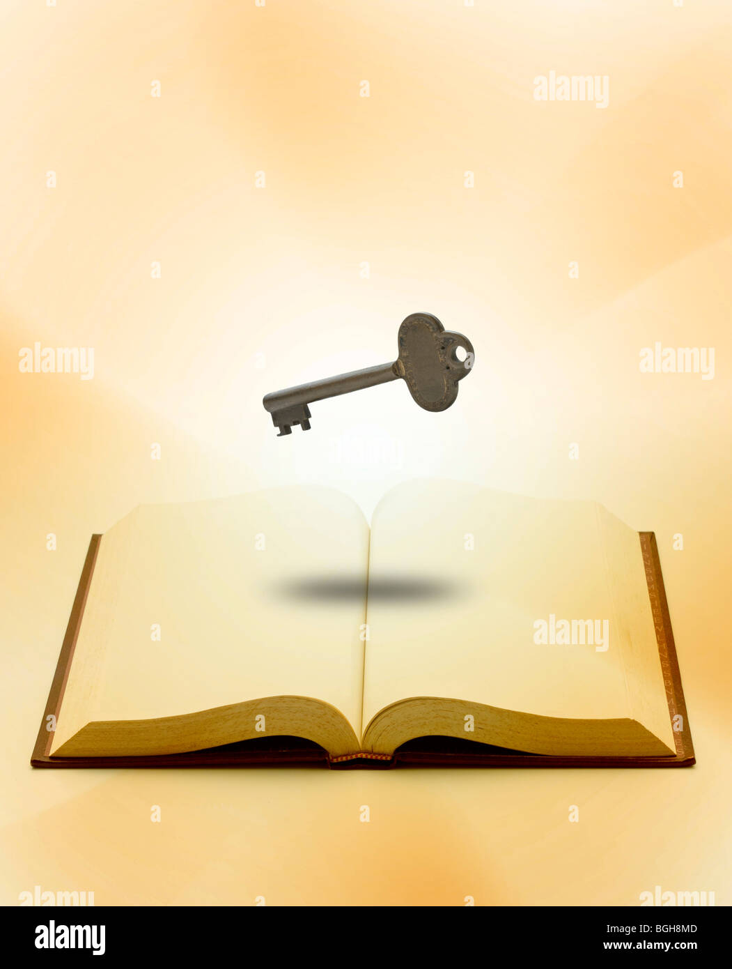 Key floating above an open book Stock Photo - Alamy