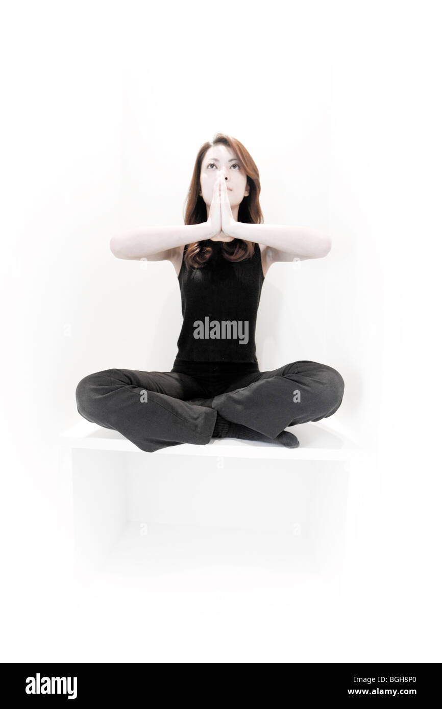 Young Woman Seat in a Kneeling Position Stock Photo - Alamy