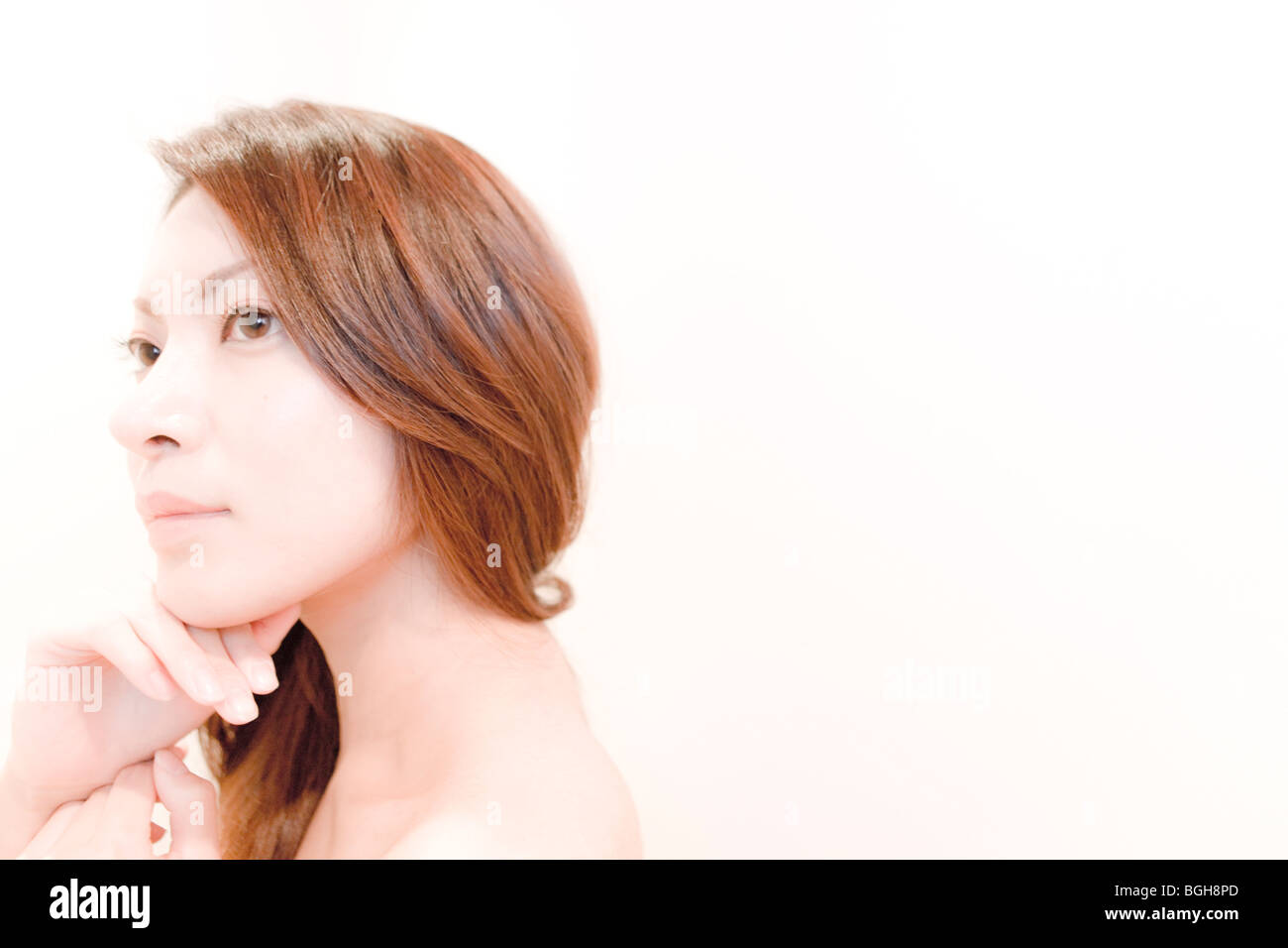 Side View of Young Woman Resting Her Chin on Right Hand Stock Photo - Alamy