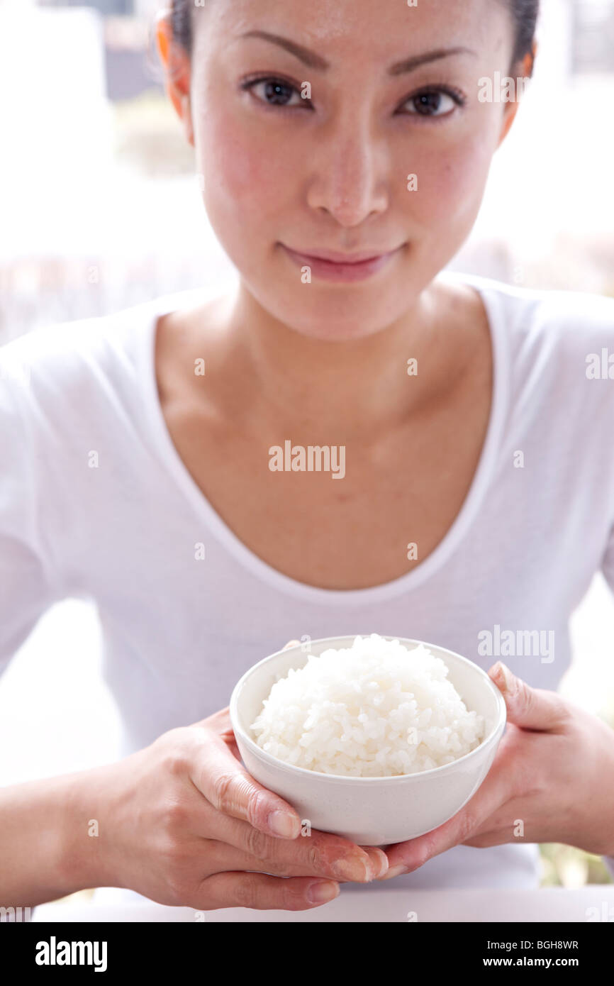 Holding Bowl Of Rice High Resolution Stock Photography and Images - Alamy
