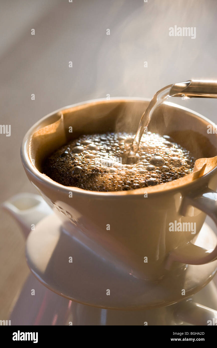 Coffee being poured into a cup Stock Photo - Alamy