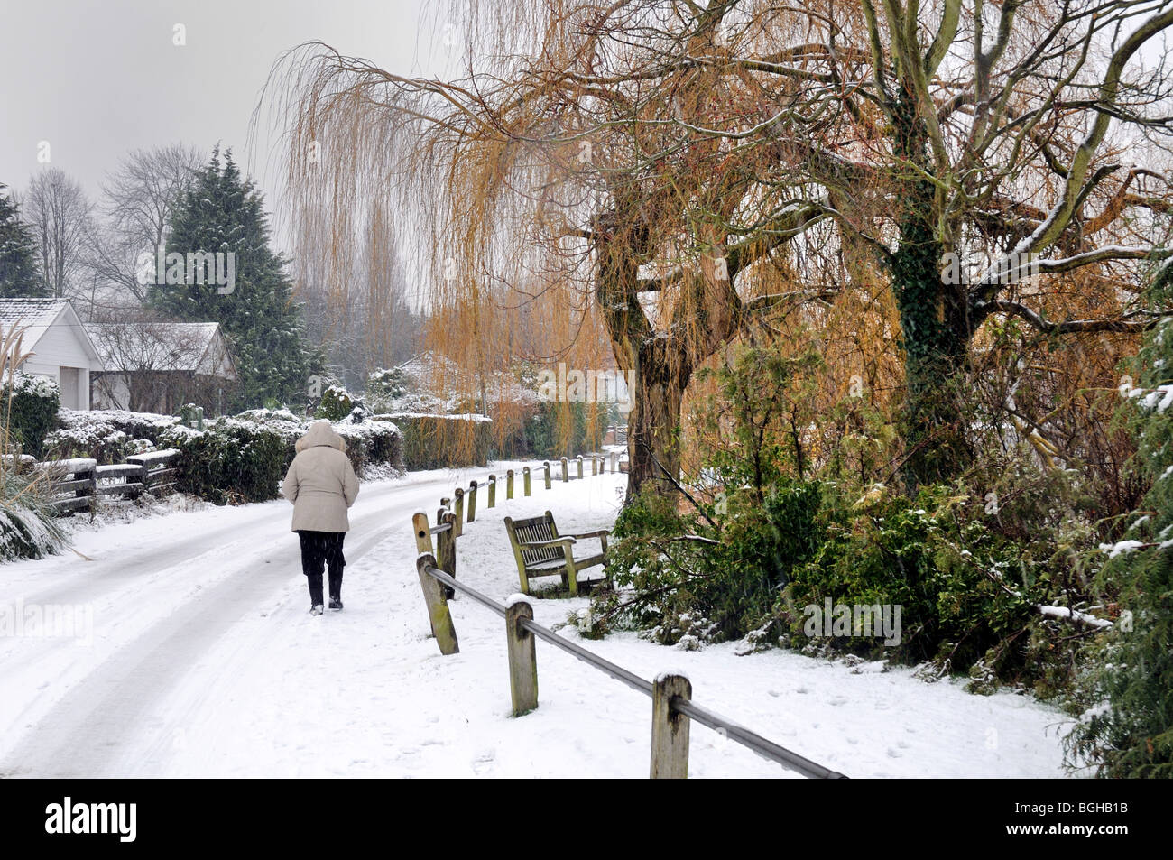 Figure walking in snow Stock Photo - Alamy