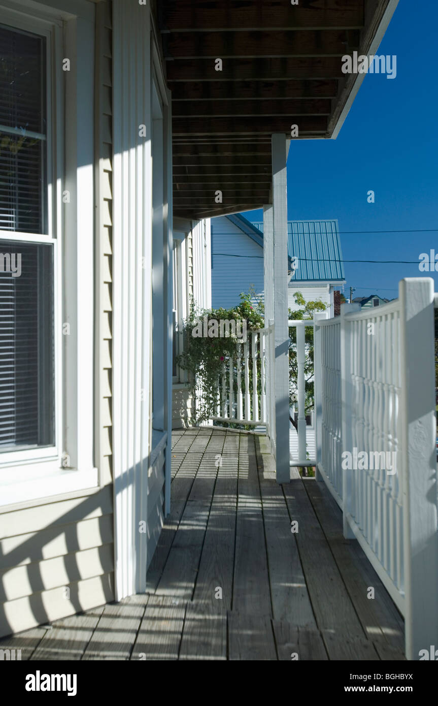 Railing shadows on wooden front porch Stock Photo - Alamy