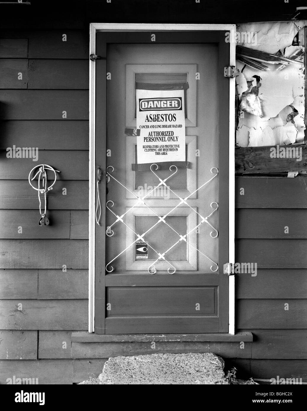 WASHINGTON - Asbestos warning on door Stock Photo - Alamy