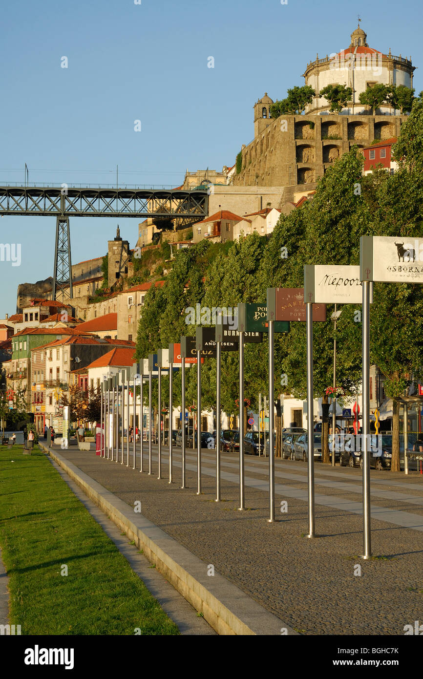 Porto. Portugal. Signs of famous Port Wine producers line the promenade ...