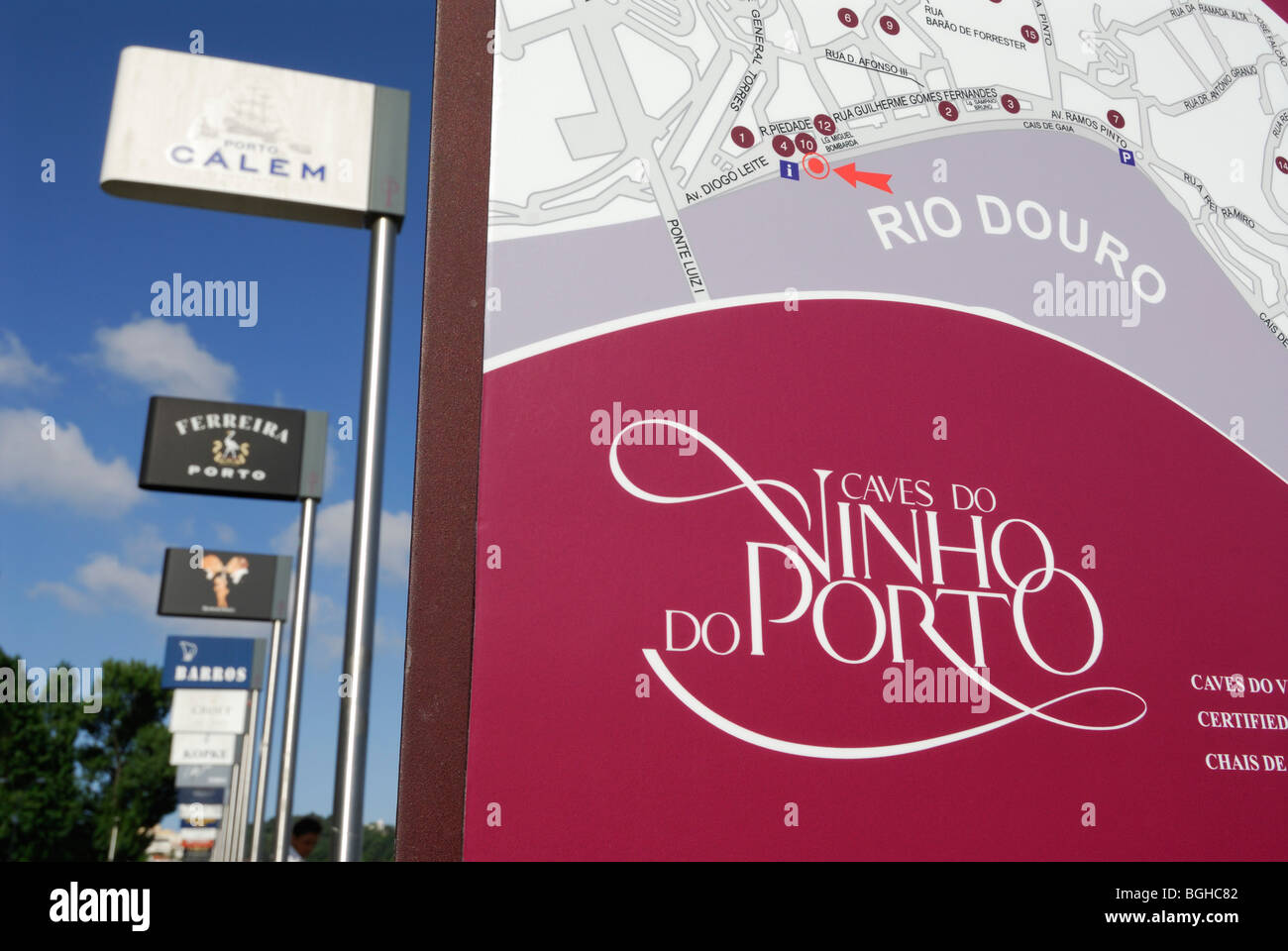 Porto. Portugal. Signs of famous Port Wine producers line the promenade ...