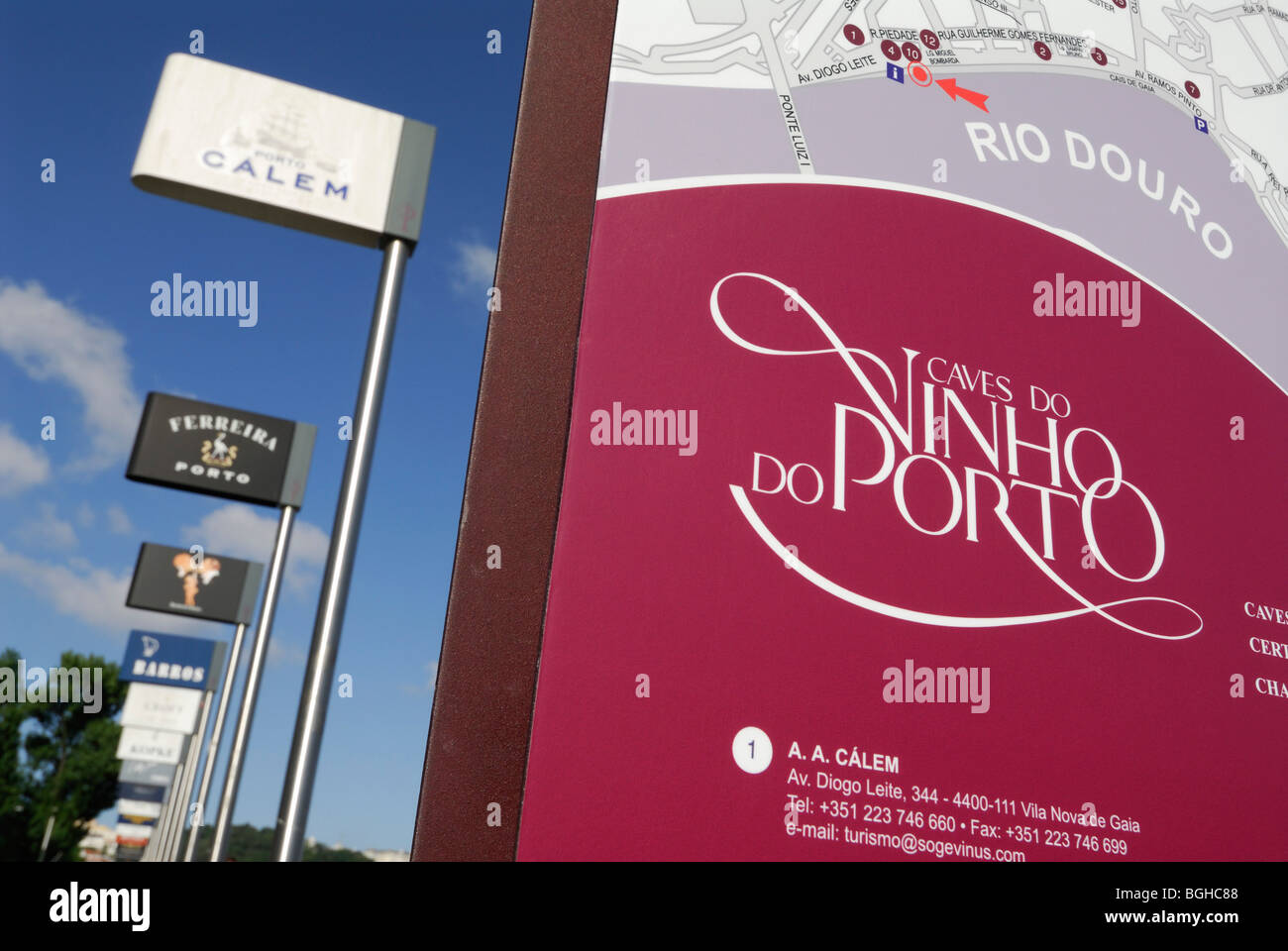 Porto. Portugal. Signs of famous Port Wine producers line the promenade ...