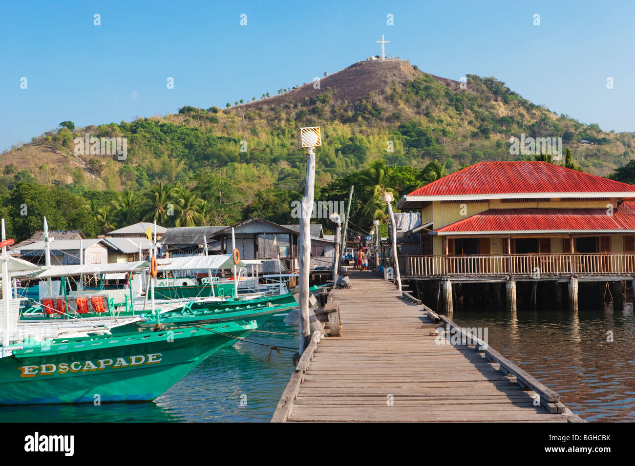 Wooden pier, banca boats and Mount Tapyas; Coron Town; Busuanga Island ...