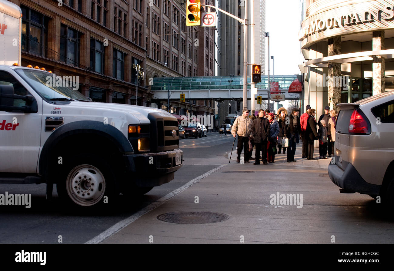 pedestrians at an intersection waiting for the light to change Stock ...