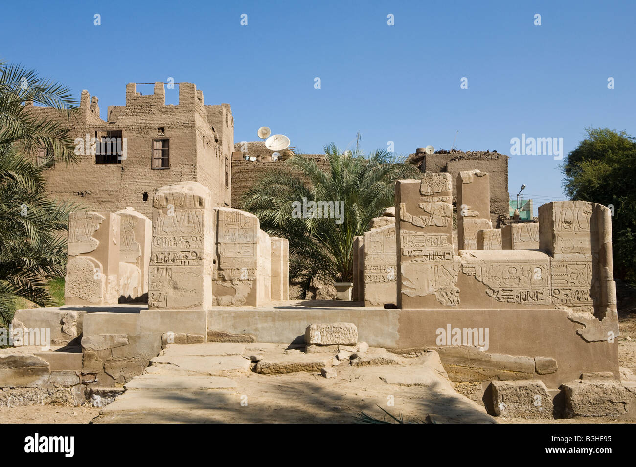 Barque shrine of Thuthmoses III in front of modern village house with ...
