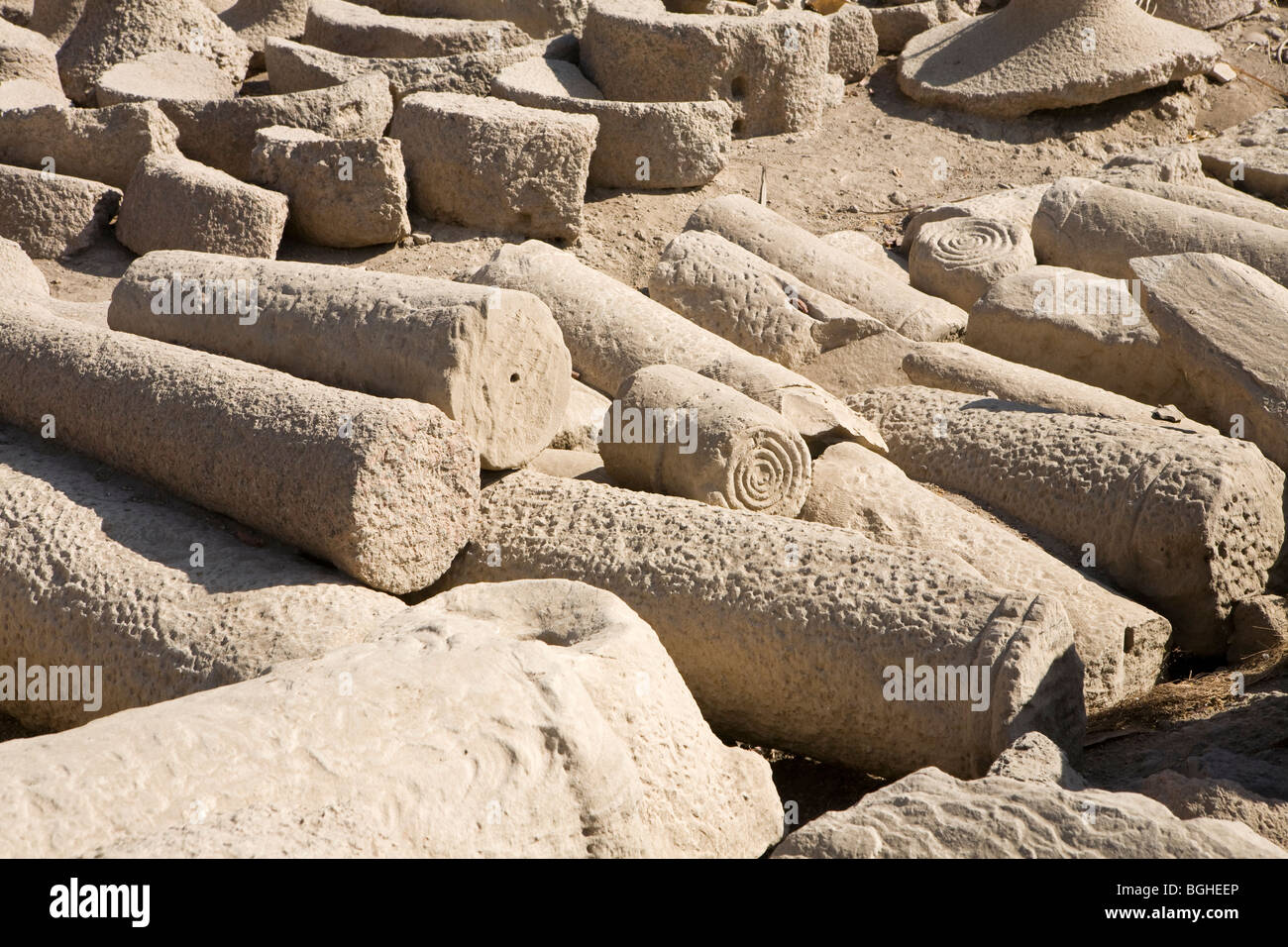 Lines of fallen pillars, some sculpted at the Temple of Montu at Tod ...