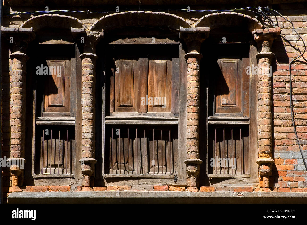Ornately carved wooden windows close to Tachupal Tole, Baktapur, Nepal ...