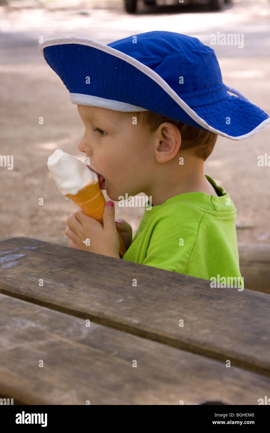 Little boy eating an ice cream cone Stock Photo - Alamy