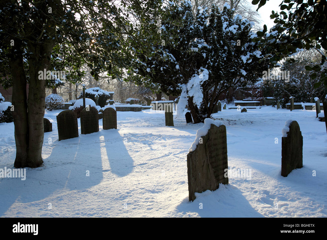 Snowy st Pitter’s church Prestbury exterior cross snow white tree ...