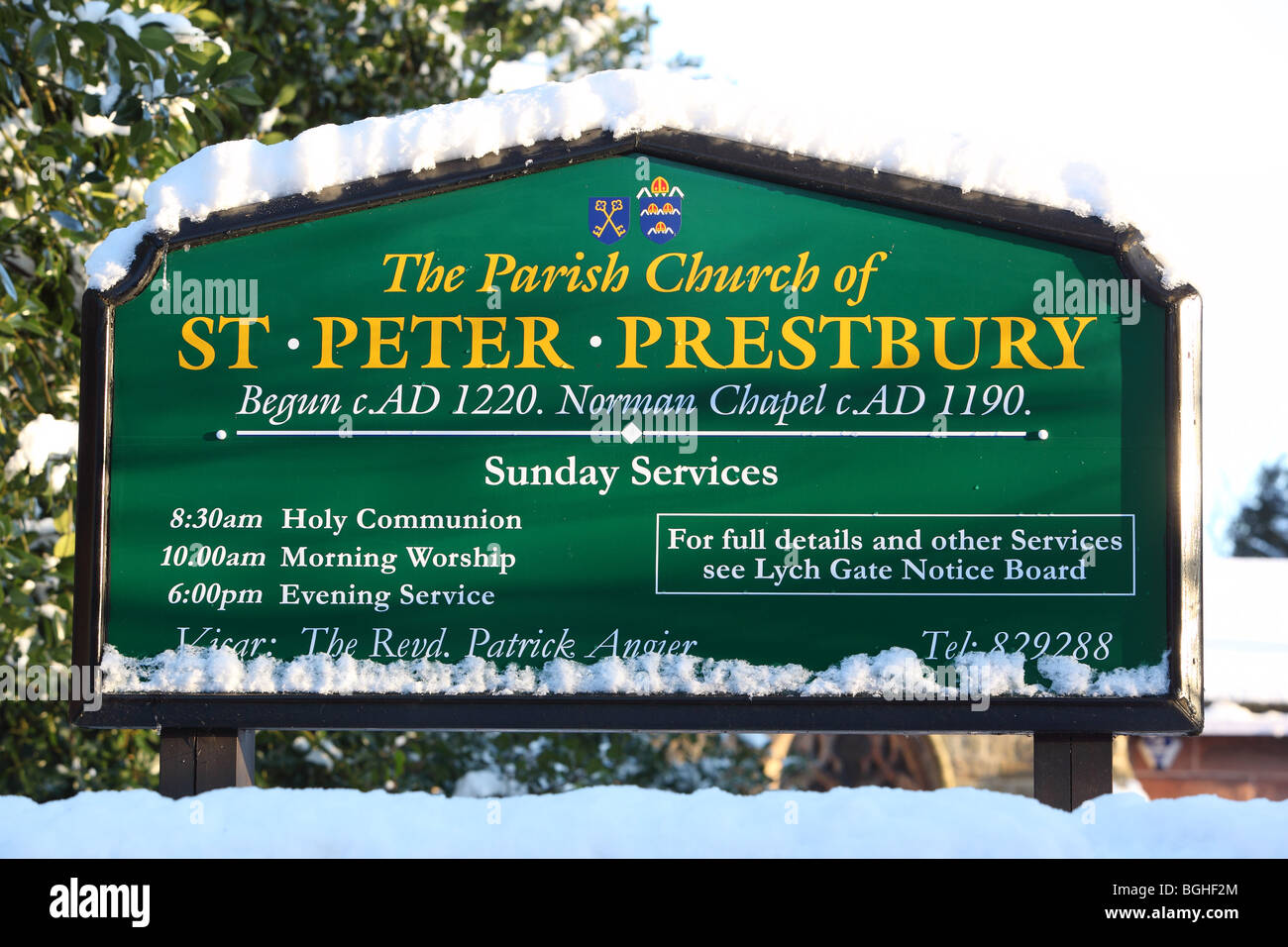 Snowy st Pitter’s church Prestbury exterior cross snow white tree ...