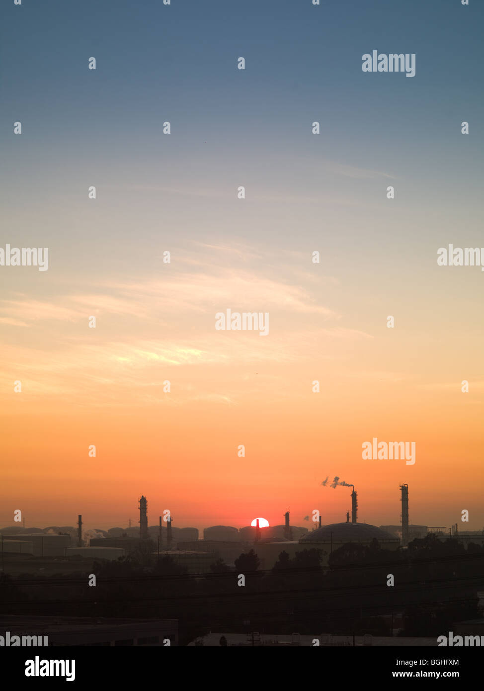 oil refinery at sunset with blue sky Stock Photo - Alamy