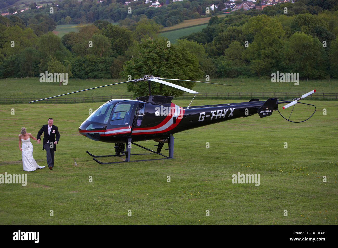 Bride and groom out of Chopper Stock Photo - Alamy