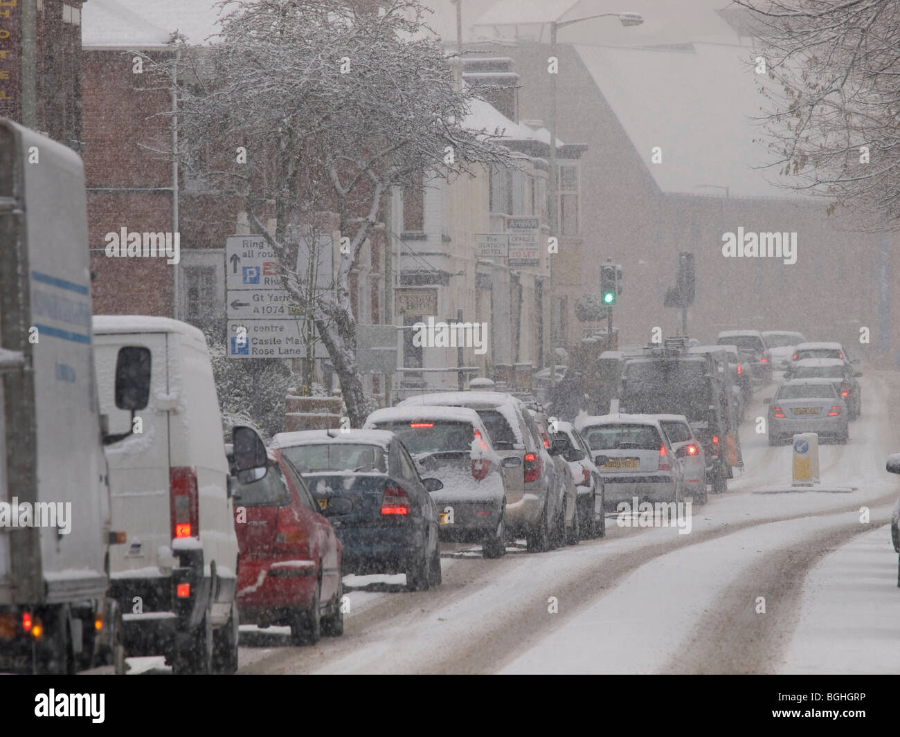 TRAFFIC IN THE SNOW ON RIVERSIDE ROAD NORWICH NORFOLK EAST ANGLIA ...