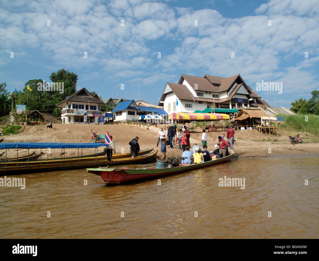 Boats on the Mekong River at the border town of Chiang Khong in ...