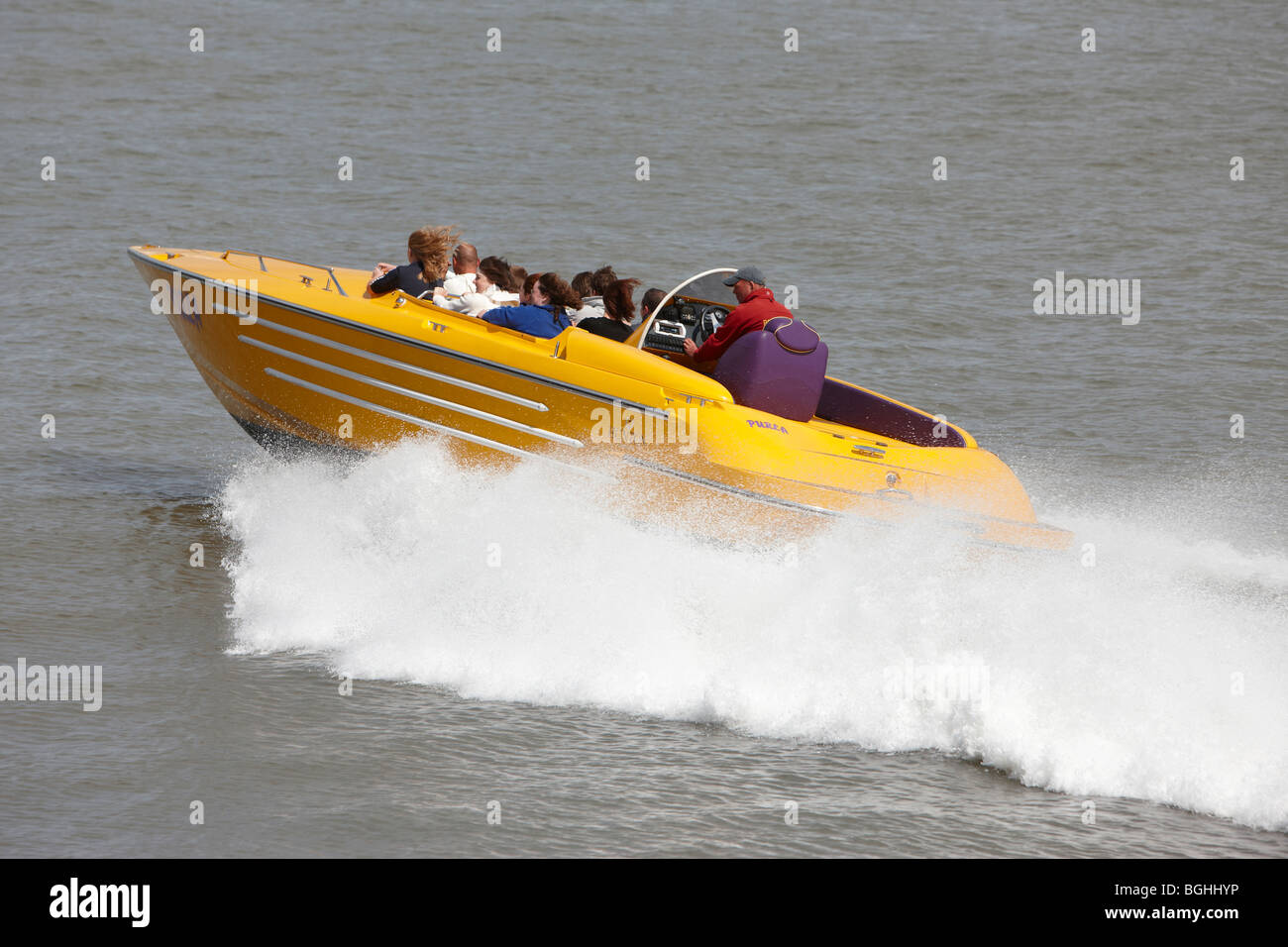 Yellow speed boat Stock Photo - Alamy