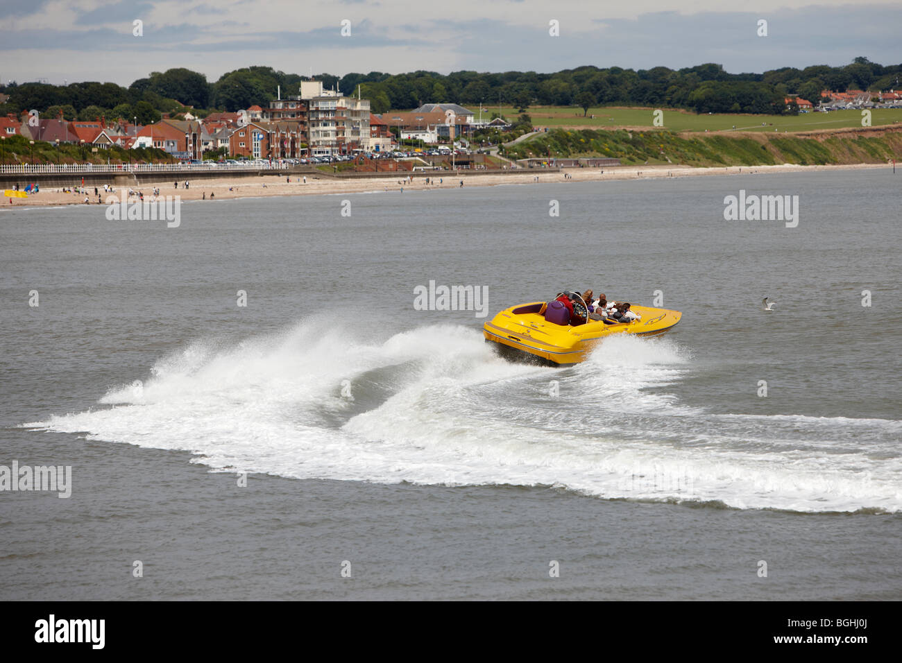Yellow speed boat Stock Photo - Alamy