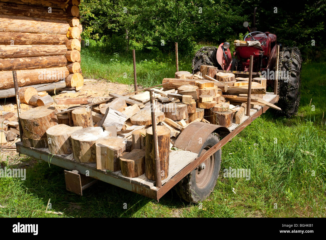 Tractor trailer full of wooden blocks that are leftovers from log cabin ...