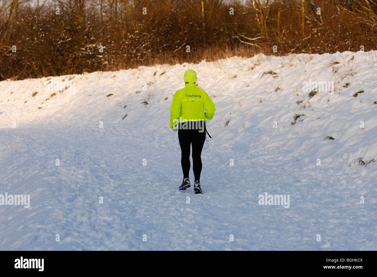 woman jogging in the snow Stock Photo - Alamy