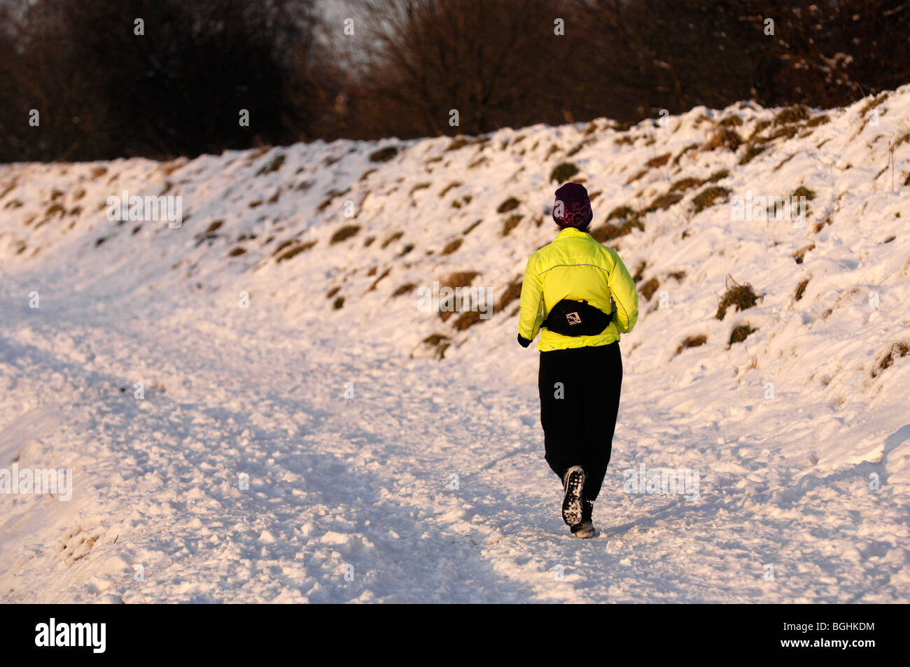 woman jogging in the snow Stock Photo - Alamy