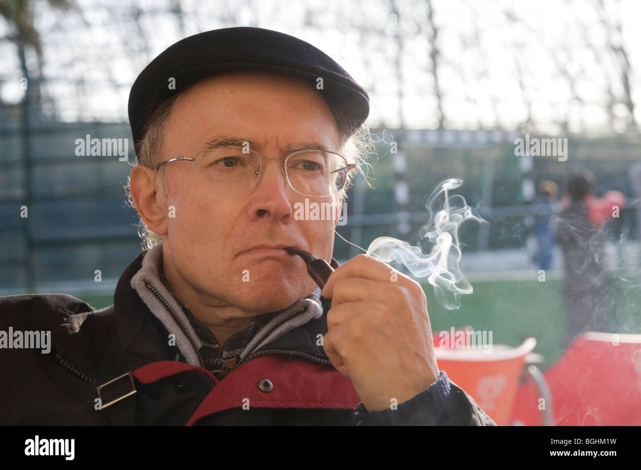 Man in his sixties smoking pipe Stock Photo - Alamy