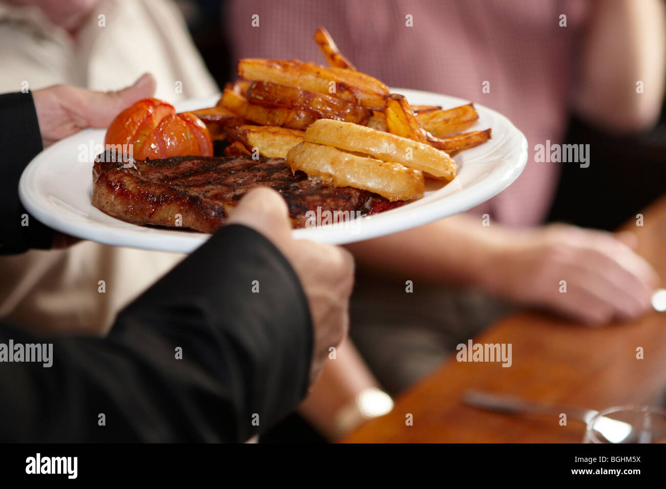 Eating Out in a pub steak and chips Stock Photo - Alamy