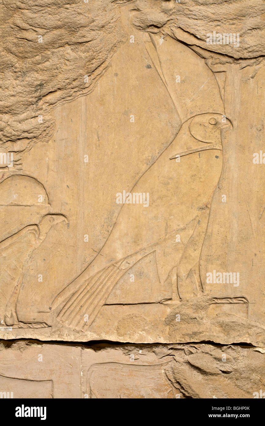 Close up of carved relief of Horus bird wearing white crown on a block ...