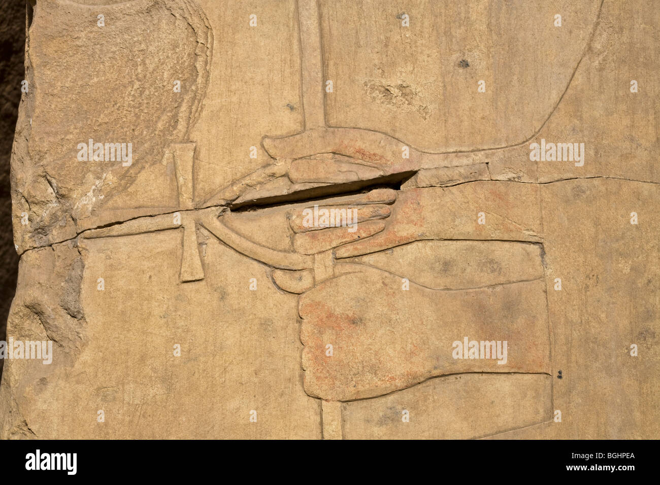 Close up of carved relief of hands holding ankh and staff on a block in ...