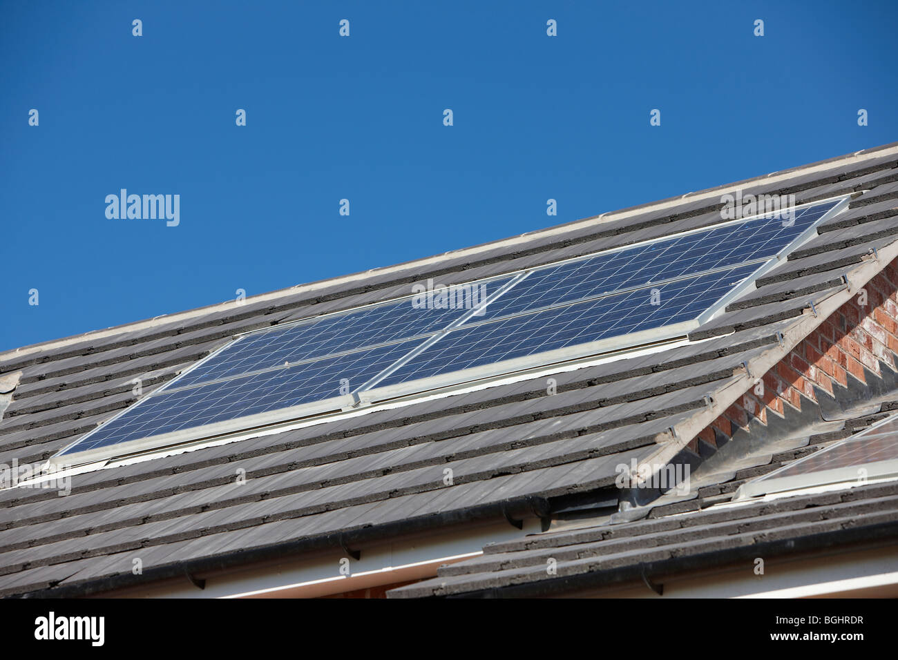 Array of Solar PV panels on roof of house Stock Photo - Alamy