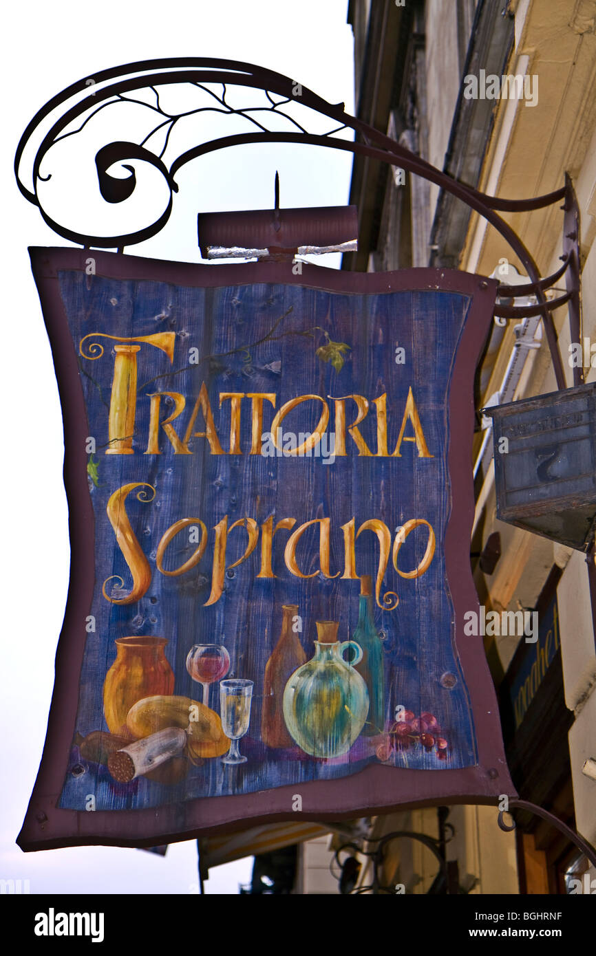 Hanging wall signs advertising local restaurants Stock Photo - Alamy