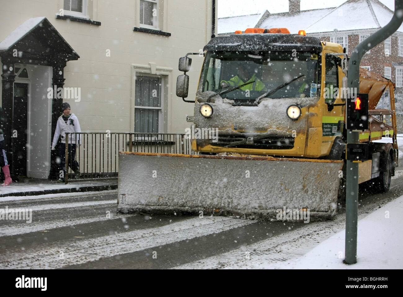 A snow plough and gritter truck at work on a Dorset road during a snow ...