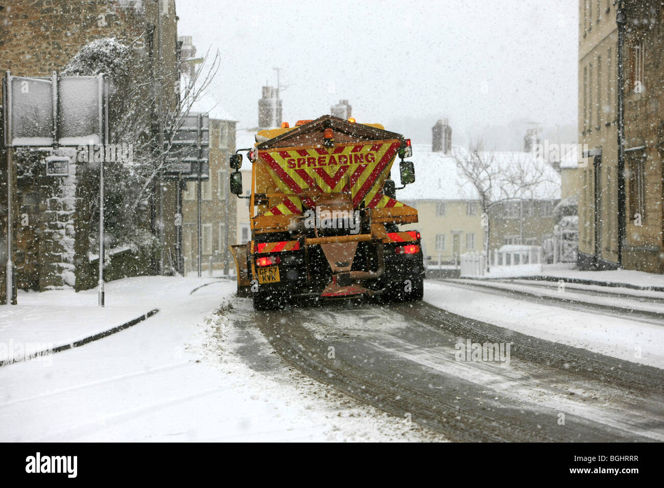 A snow plough and gritter truck at work on a Dorset road during a snow ...