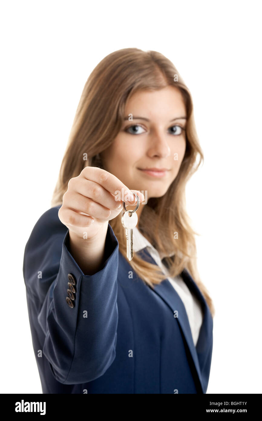 Portrait of Young and beautiful business woman holding keys - Focus is ...