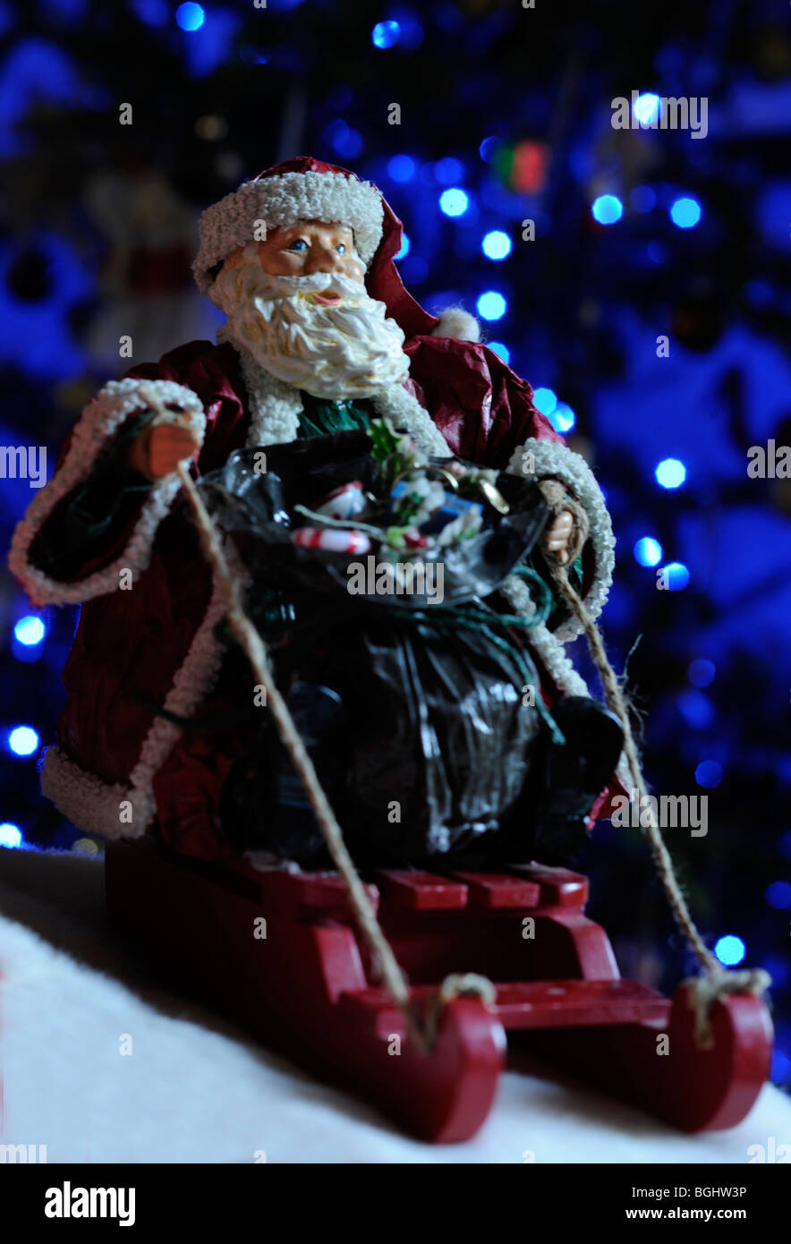 Model Father Christmas on sleigh with Christmas tree behind him with ...