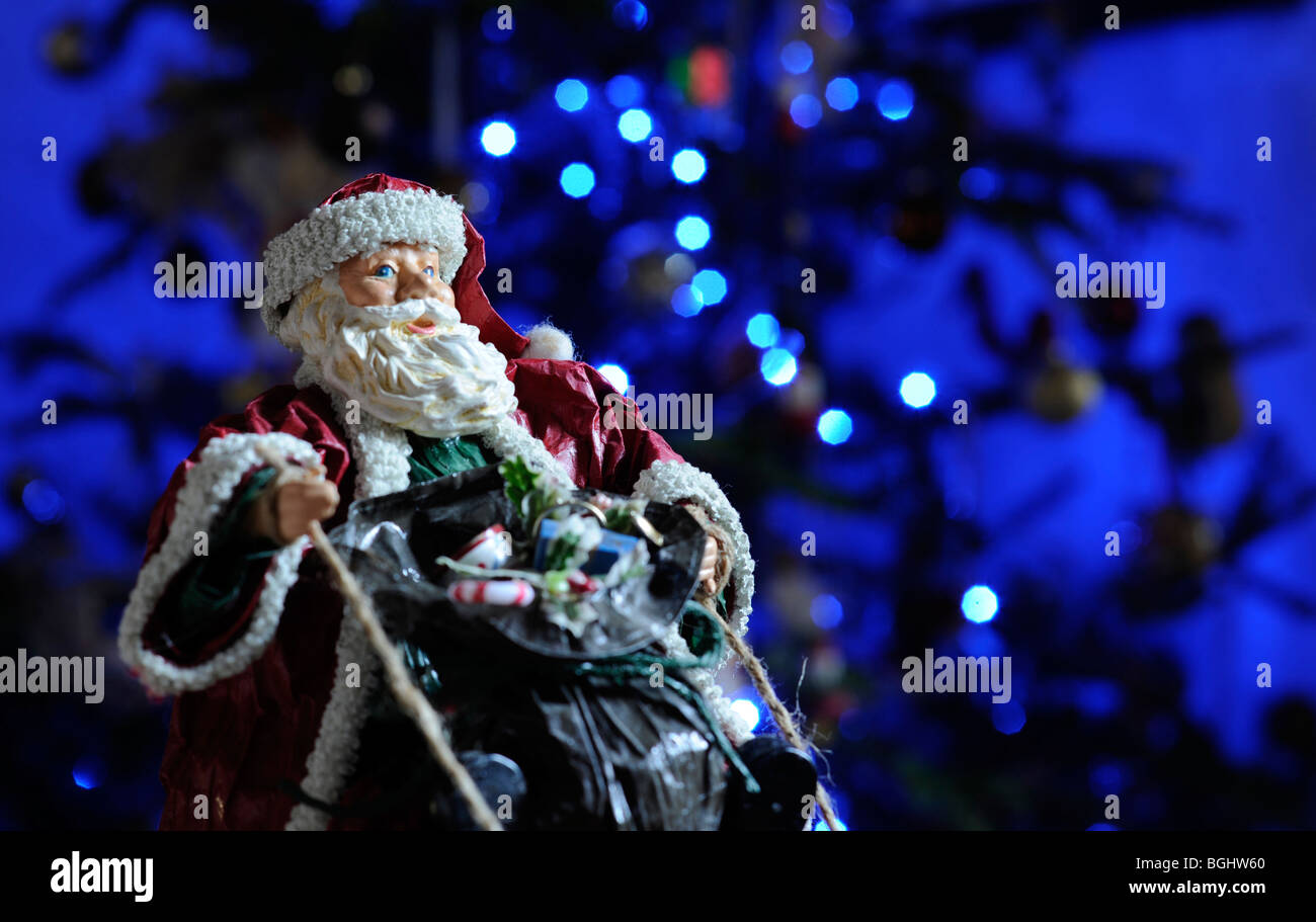 Model Father Christmas on sleigh with Christmas tree behind him with ...