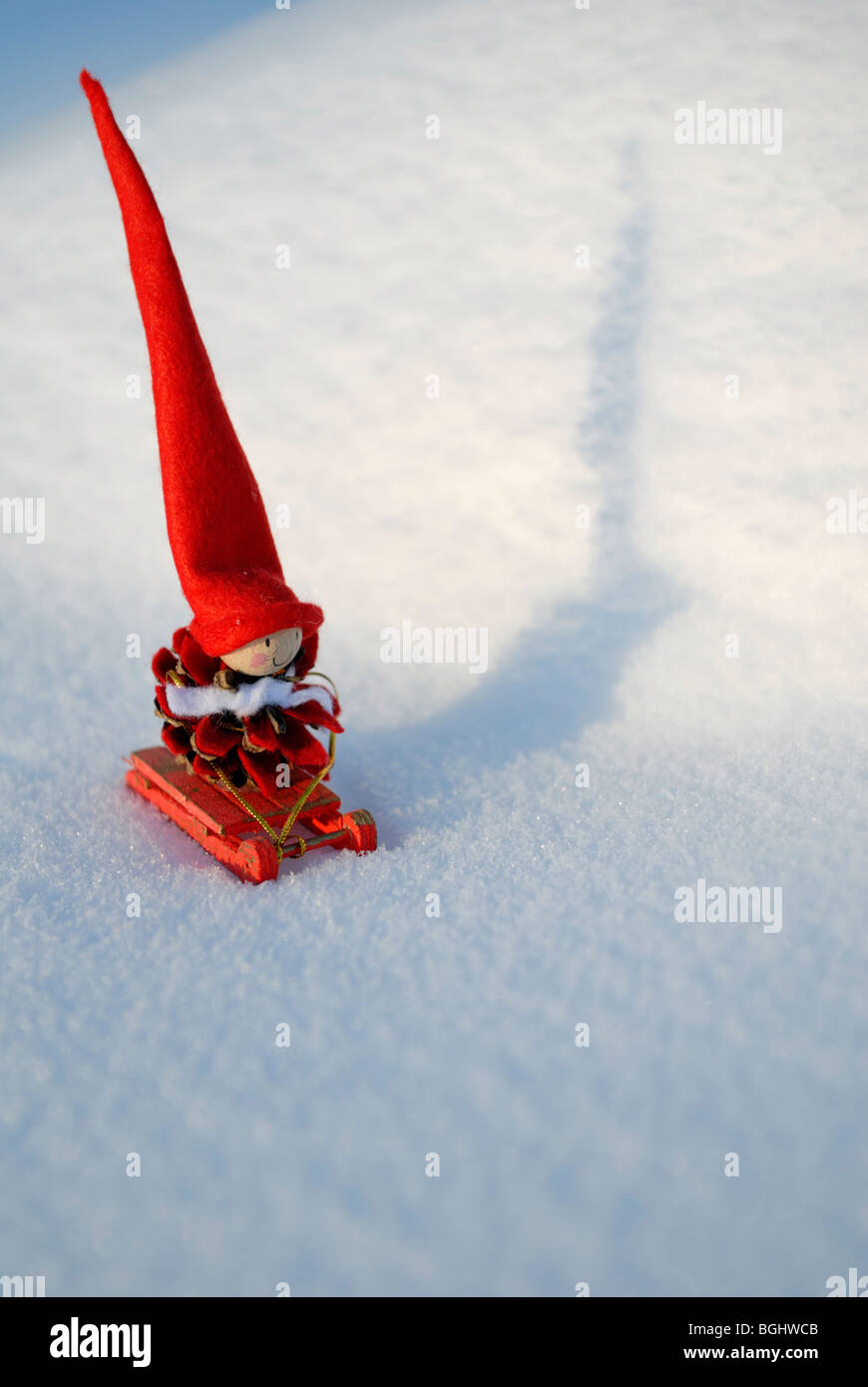 An elf sliding down the hill on the sledge. Helsinki, Finland ...