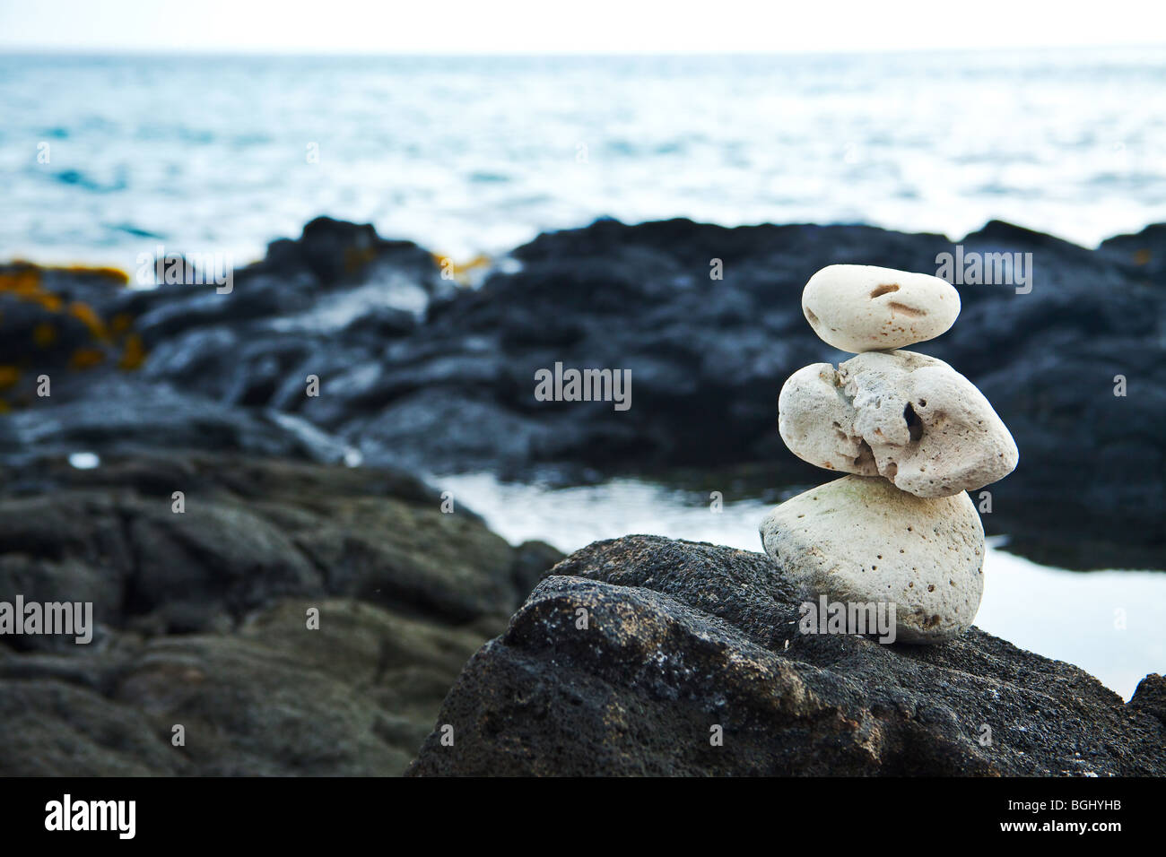 White Zen rocks on Hawaiian coastline with lava Stock Photo - Alamy