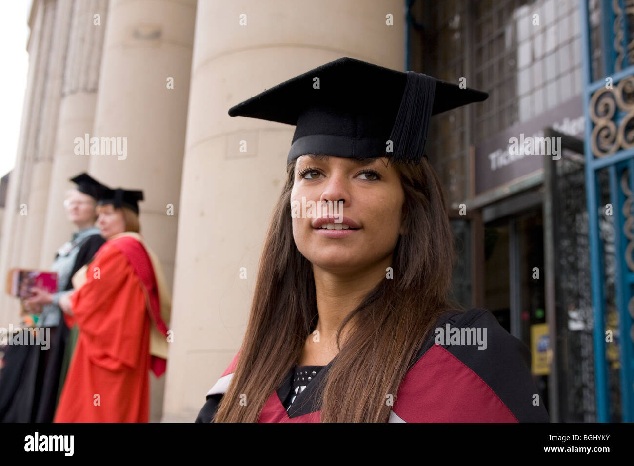 apprehensive young woman on graduation day outside venue Stock Photo ...