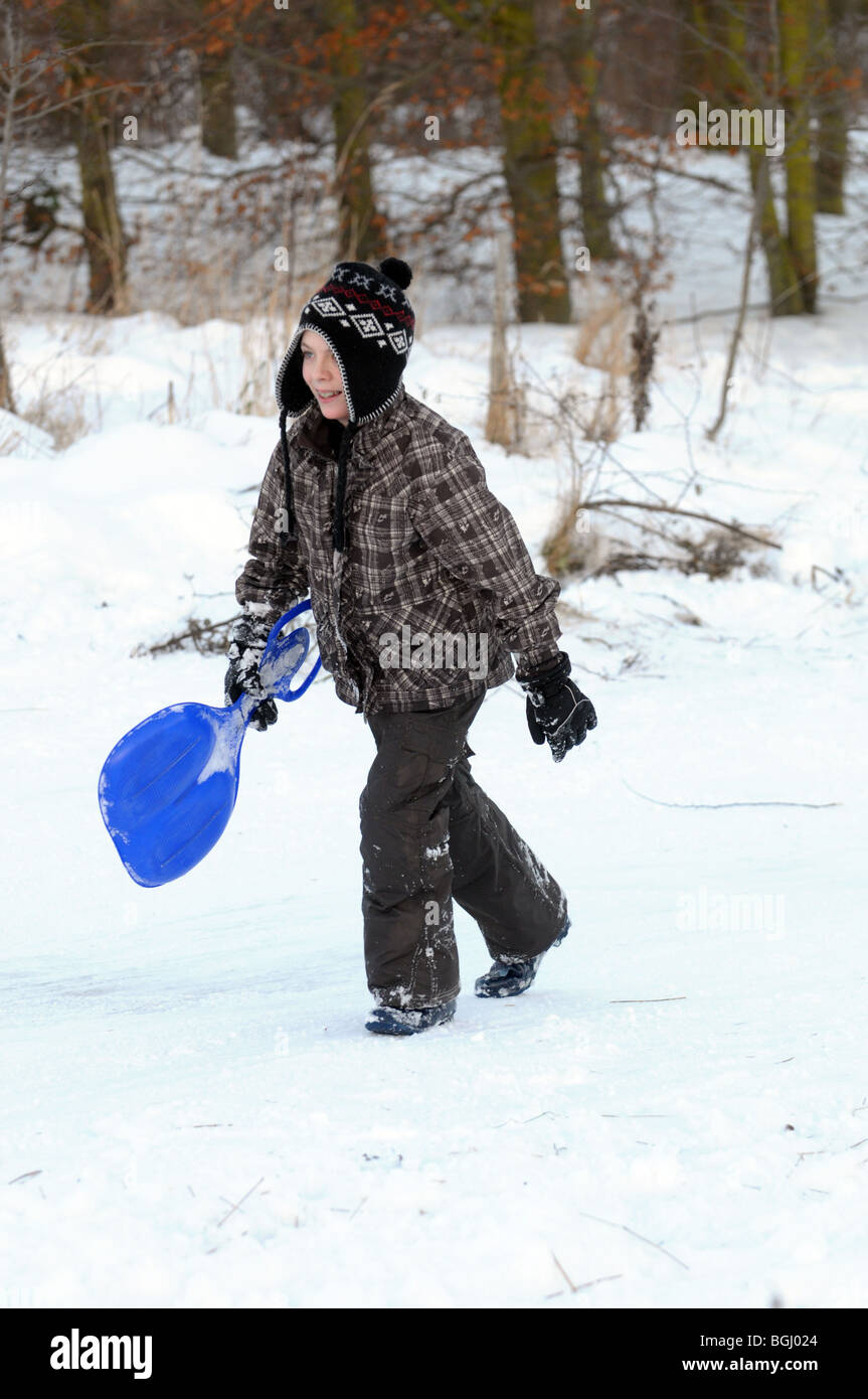 Young boys and girls sledging in Scotland Stock Photo - Alamy