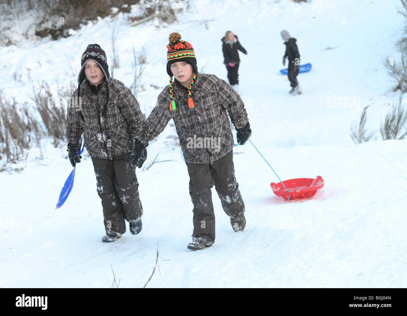 Boys sledging hi-res stock photography and images - Alamy