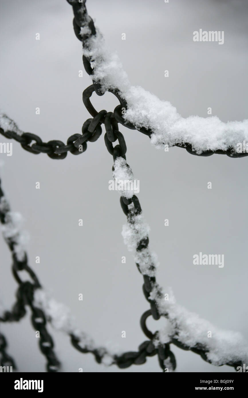 Linked Metal Chains Covered in Snow Stock Photo - Alamy